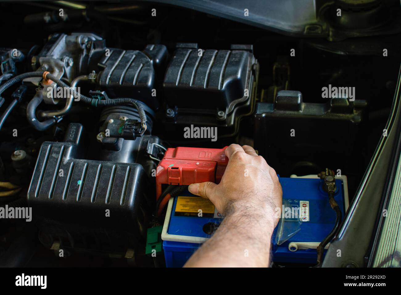 Concept of engine maintenance. Technician is checking the level of ...