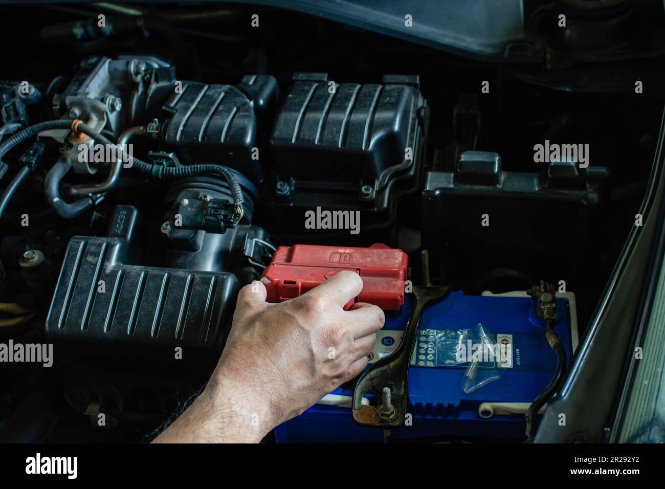 Concept of engine maintenance. Technician is checking the level of ...