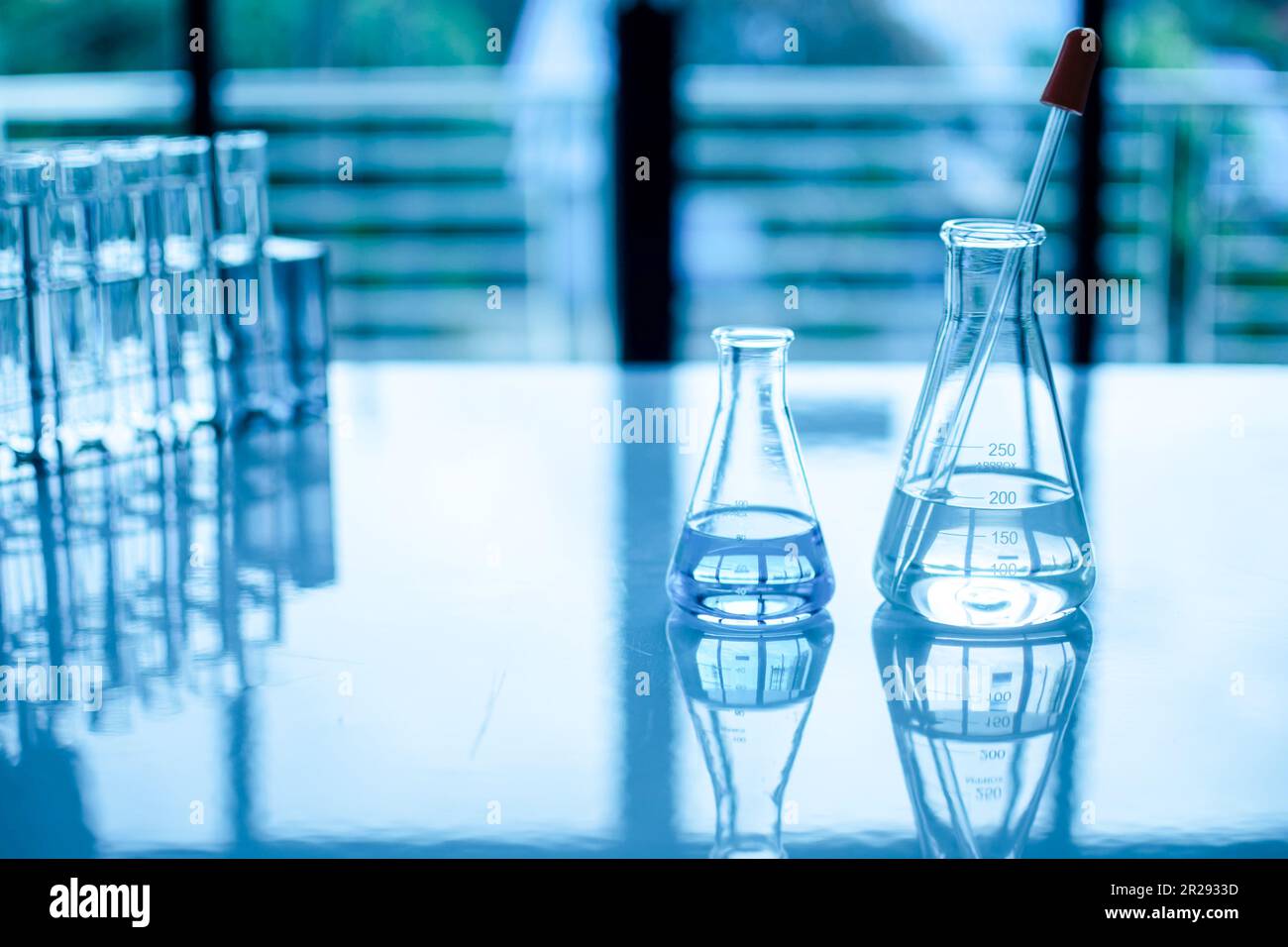 Chemistry experiment concept in science laboratory Two science flasks ... Chemistry experiment concept in science laboratory Two science flasks ...