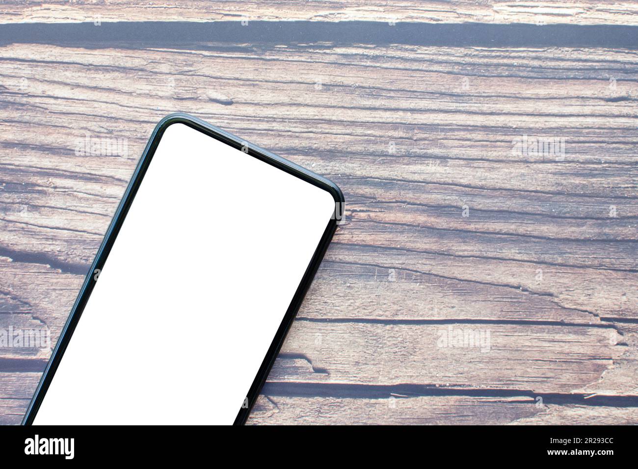 Smartphone color black and white screen on the wooden desk background ...