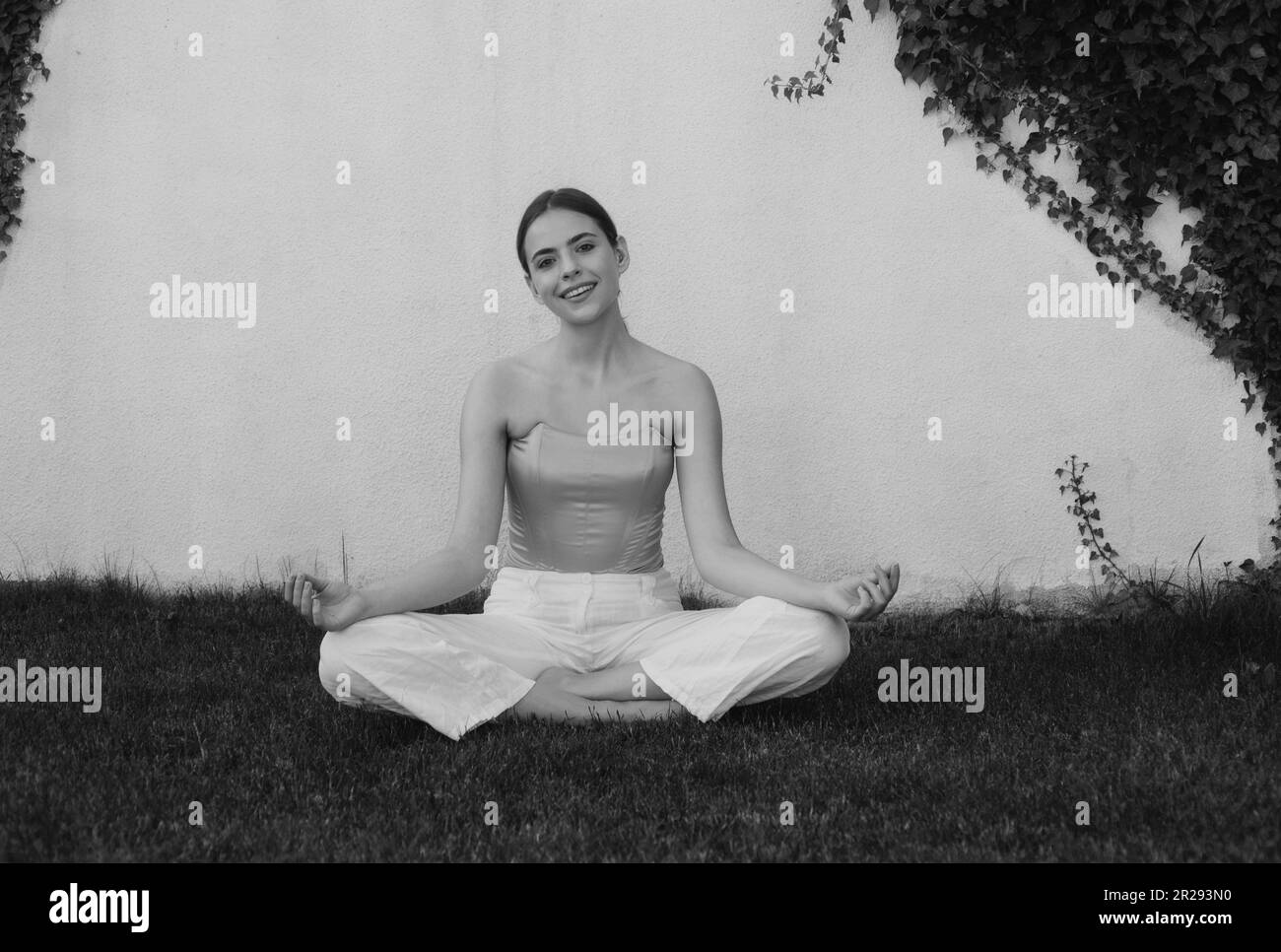Meditation yoga woman in spring park. Yoga woman stretching with pose ...