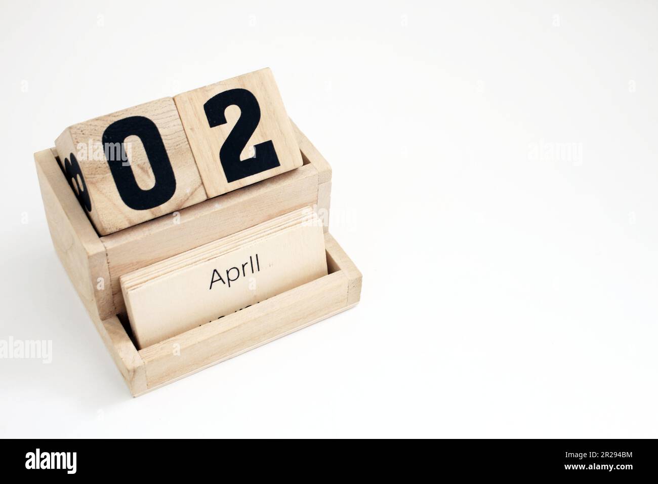 Wooden perpetual calendar showing the 2nd of April Stock Photo - Alamy