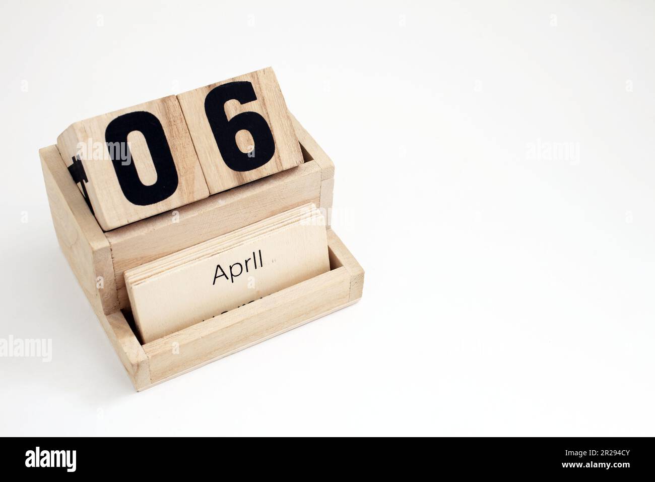 Wooden perpetual calendar showing the 6th of April Stock Photo - Alamy