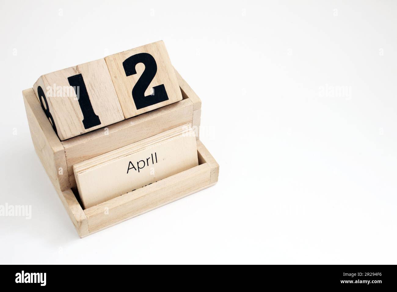 Wooden perpetual calendar showing the 12th of April Stock Photo - Alamy