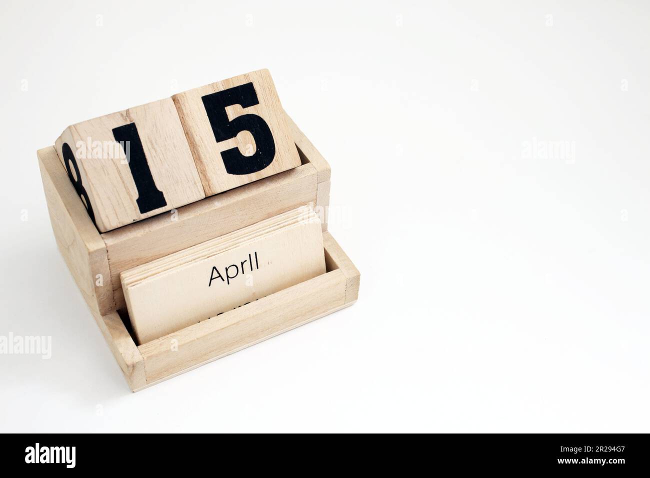 Wooden perpetual calendar showing the 15th of April Stock Photo - Alamy