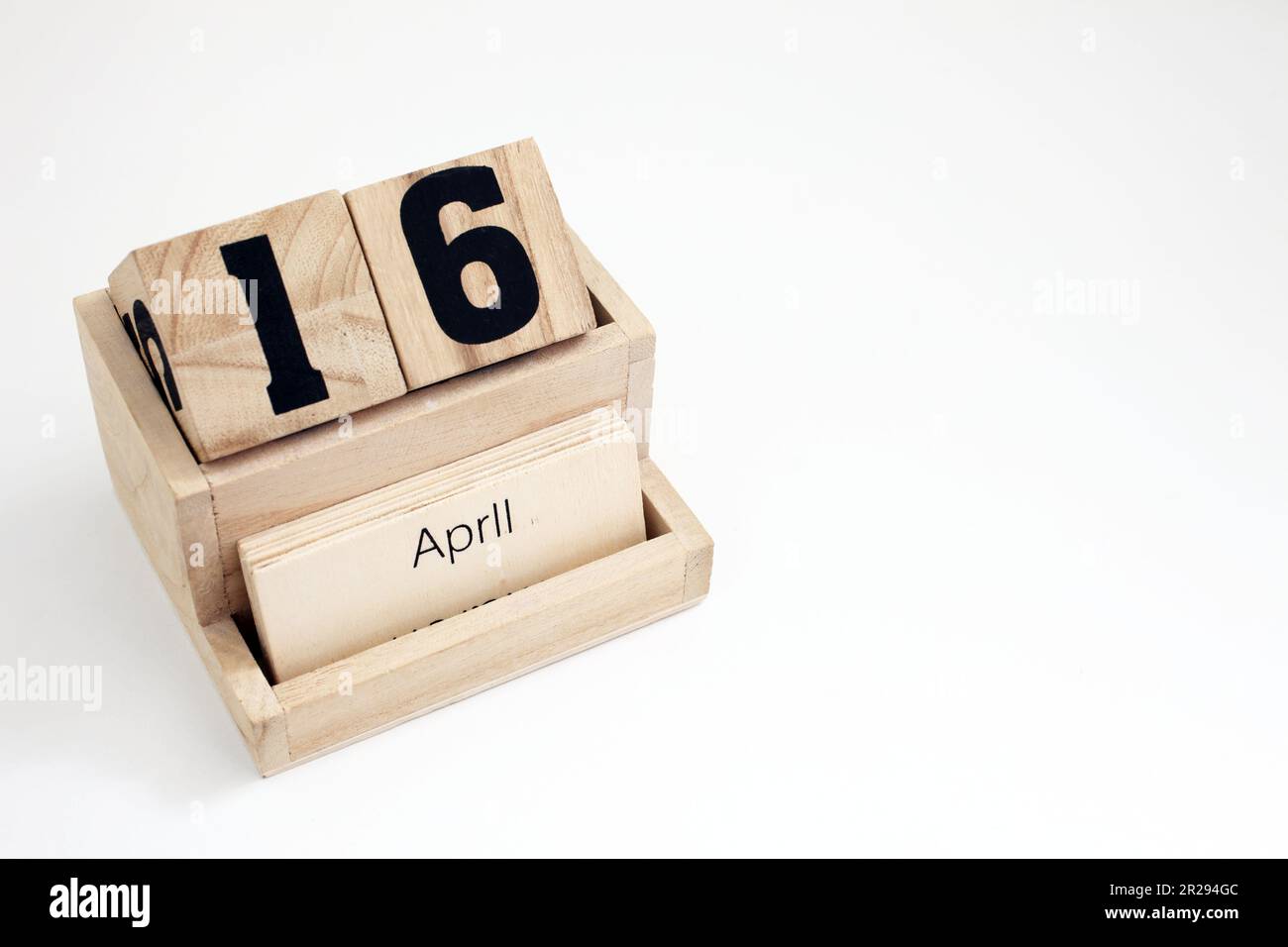 Wooden perpetual calendar showing the 16th of April Stock Photo - Alamy