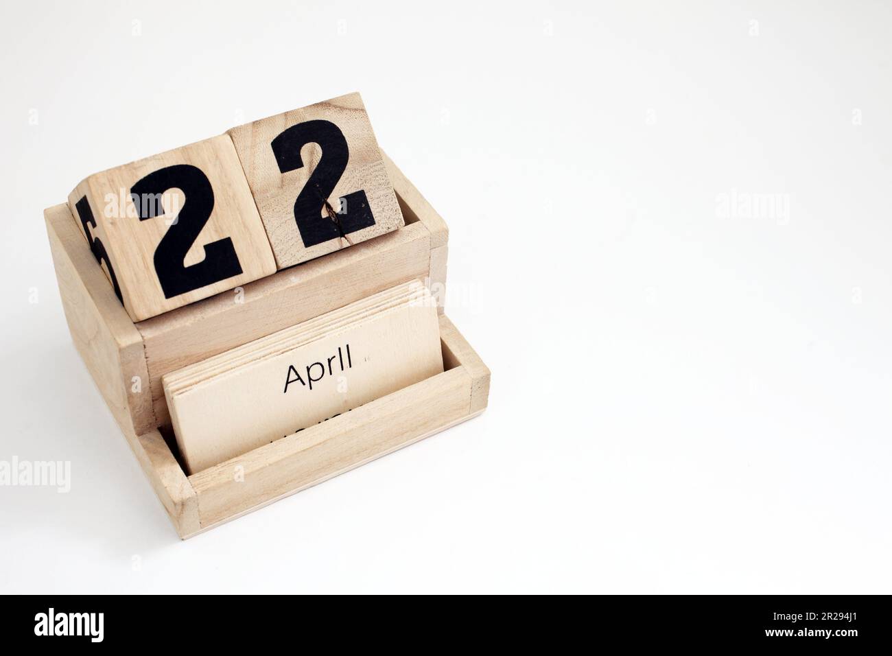 Wooden perpetual calendar showing the 22nd of April Stock Photo - Alamy
