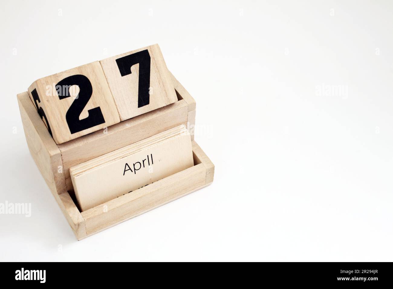 Wooden perpetual calendar showing the 27th of April Stock Photo - Alamy