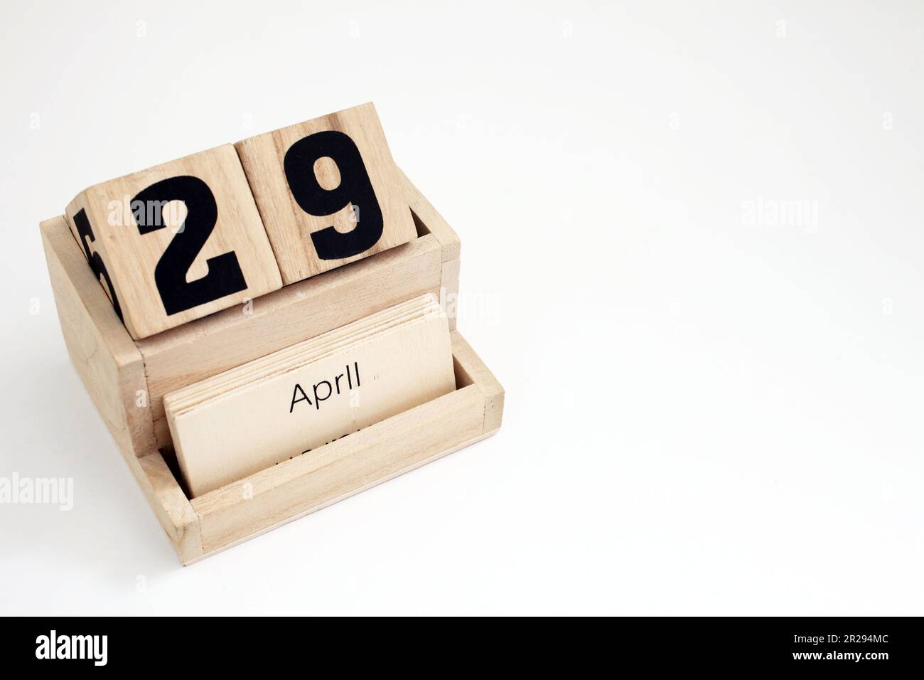 Wooden perpetual calendar showing the 29th of April Stock Photo - Alamy