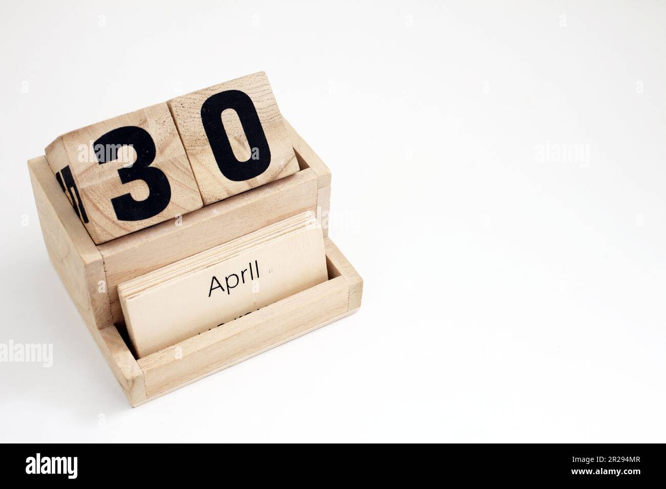 Wooden perpetual calendar showing the 30th of April Stock Photo - Alamy