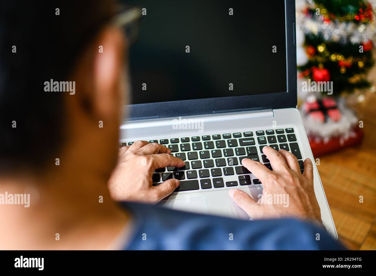 Closeup, People using laptop computer devices at home. A man typing a ...