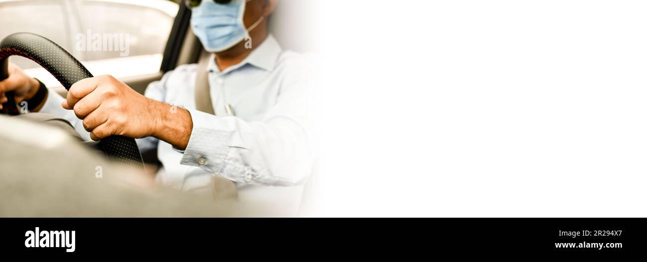 Daylight, Closeup a man driving two hands to hold the steering wheel to ...