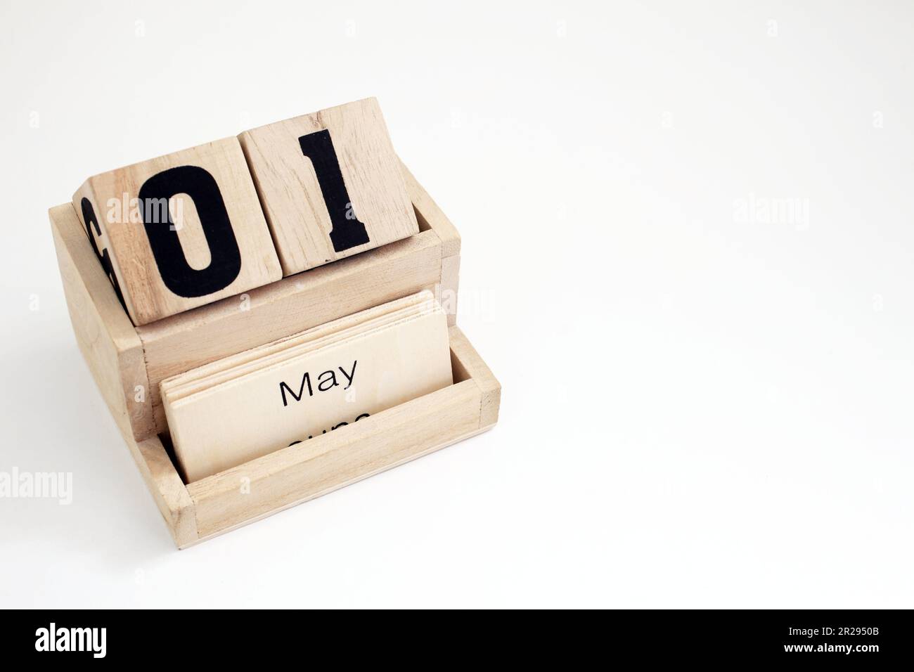 Wooden perpetual calendar showing the 1st of May Stock Photo - Alamy