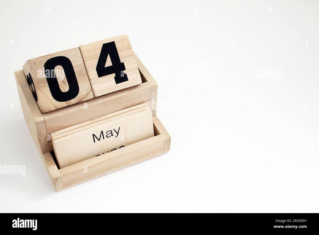 Wooden perpetual calendar showing the 4th of May Stock Photo - Alamy
