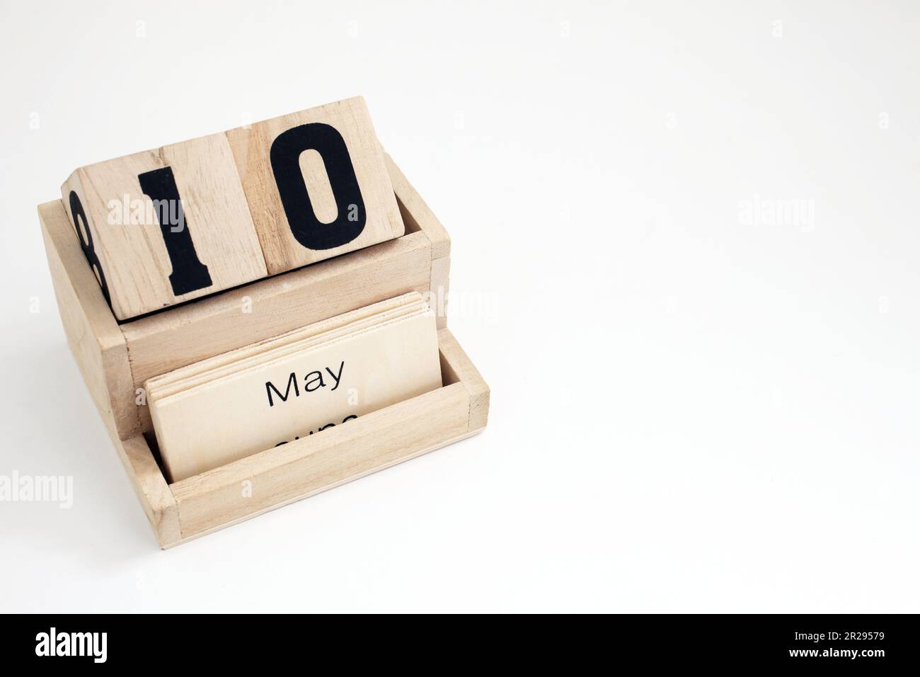 Wooden perpetual calendar showing the 10th of May Stock Photo - Alamy