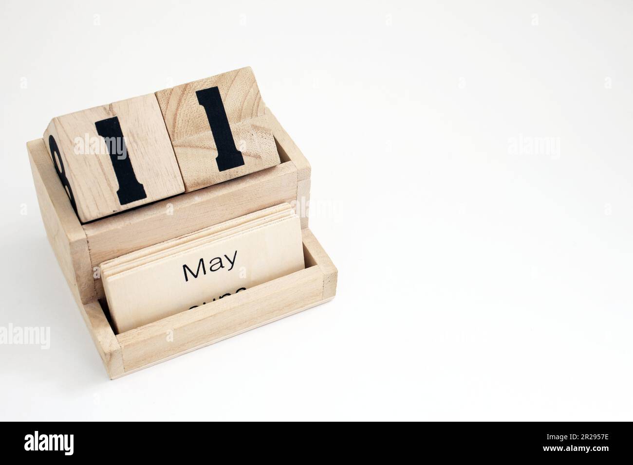 Wooden perpetual calendar showing the 11th of May Stock Photo - Alamy