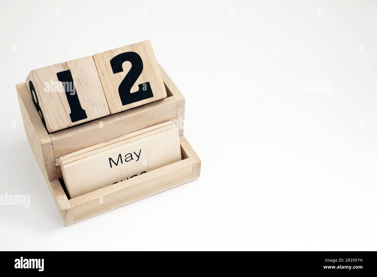 Wooden perpetual calendar showing the 12th of May Stock Photo - Alamy