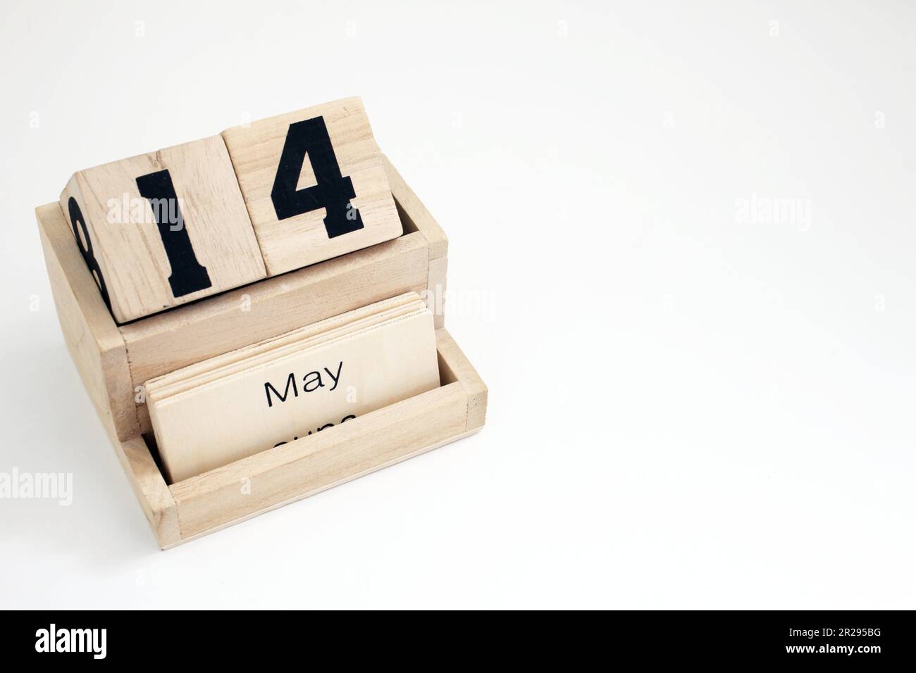 Wooden perpetual calendar showing the 14th of May Stock Photo - Alamy