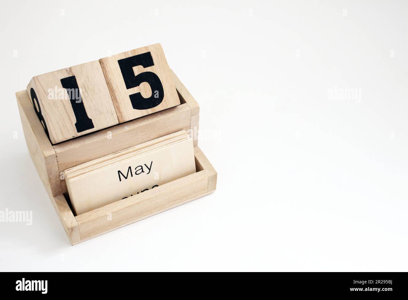 Wooden perpetual calendar showing the 15th of May Stock Photo - Alamy