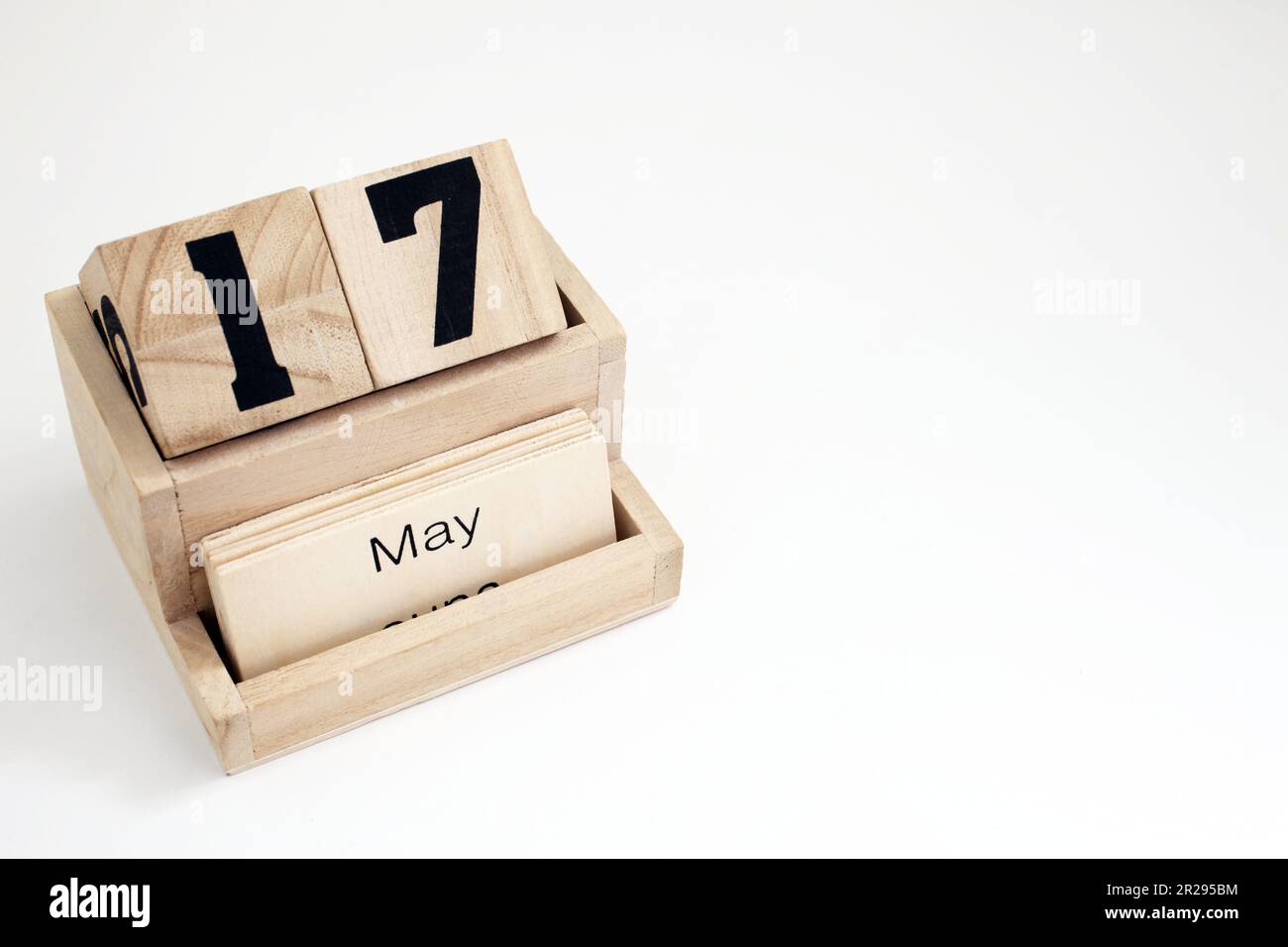 Wooden perpetual calendar showing the 17th of May Stock Photo - Alamy