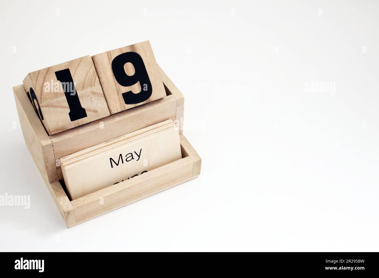 Wooden perpetual calendar showing the 19th of May Stock Photo - Alamy