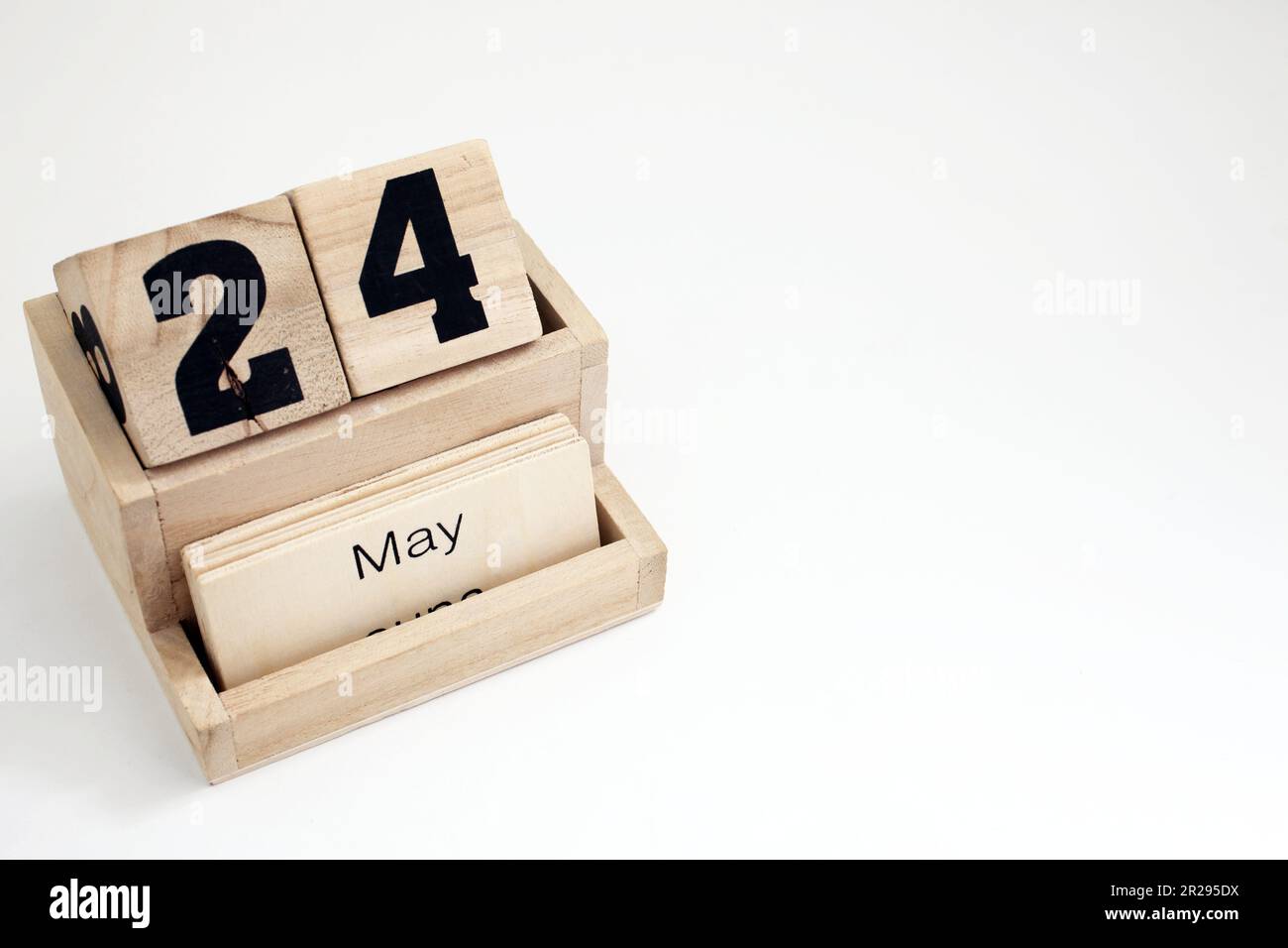 Wooden perpetual calendar showing the 24th of May Stock Photo - Alamy