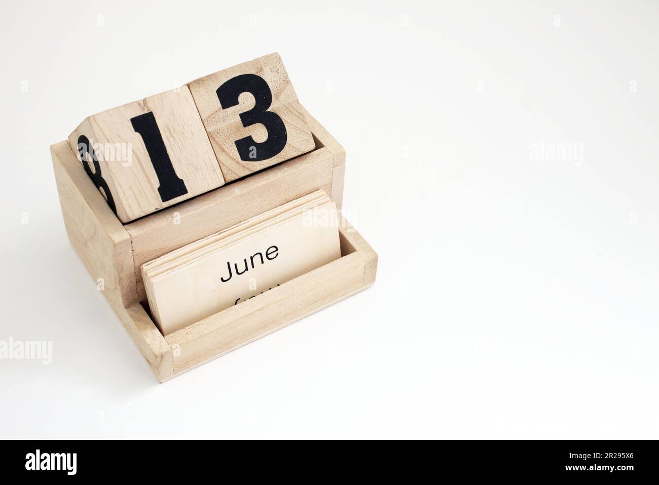 Wooden perpetual calendar showing the 13th of June Stock Photo - Alamy