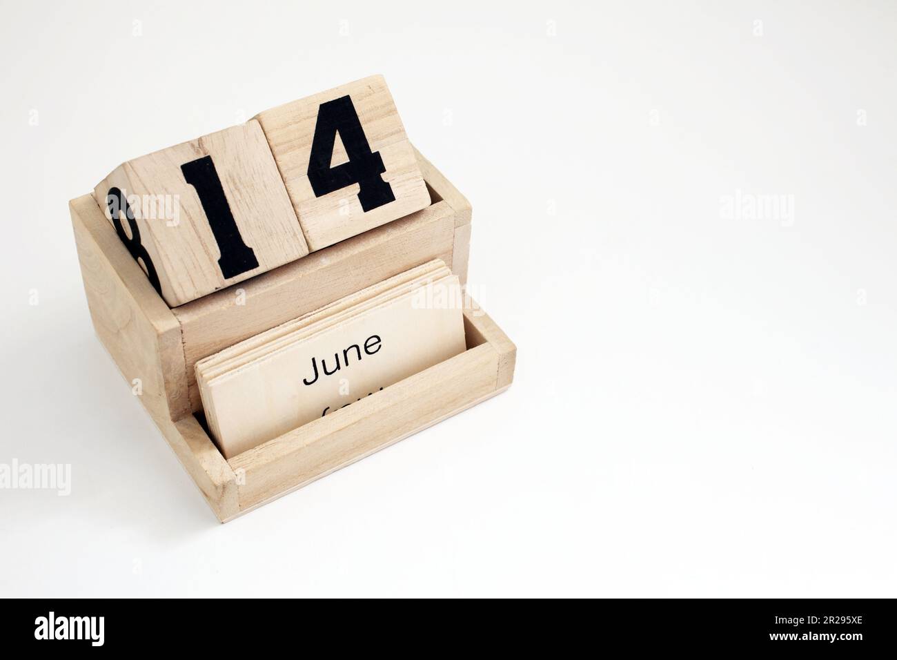 Wooden perpetual calendar showing the 14th of June Stock Photo - Alamy