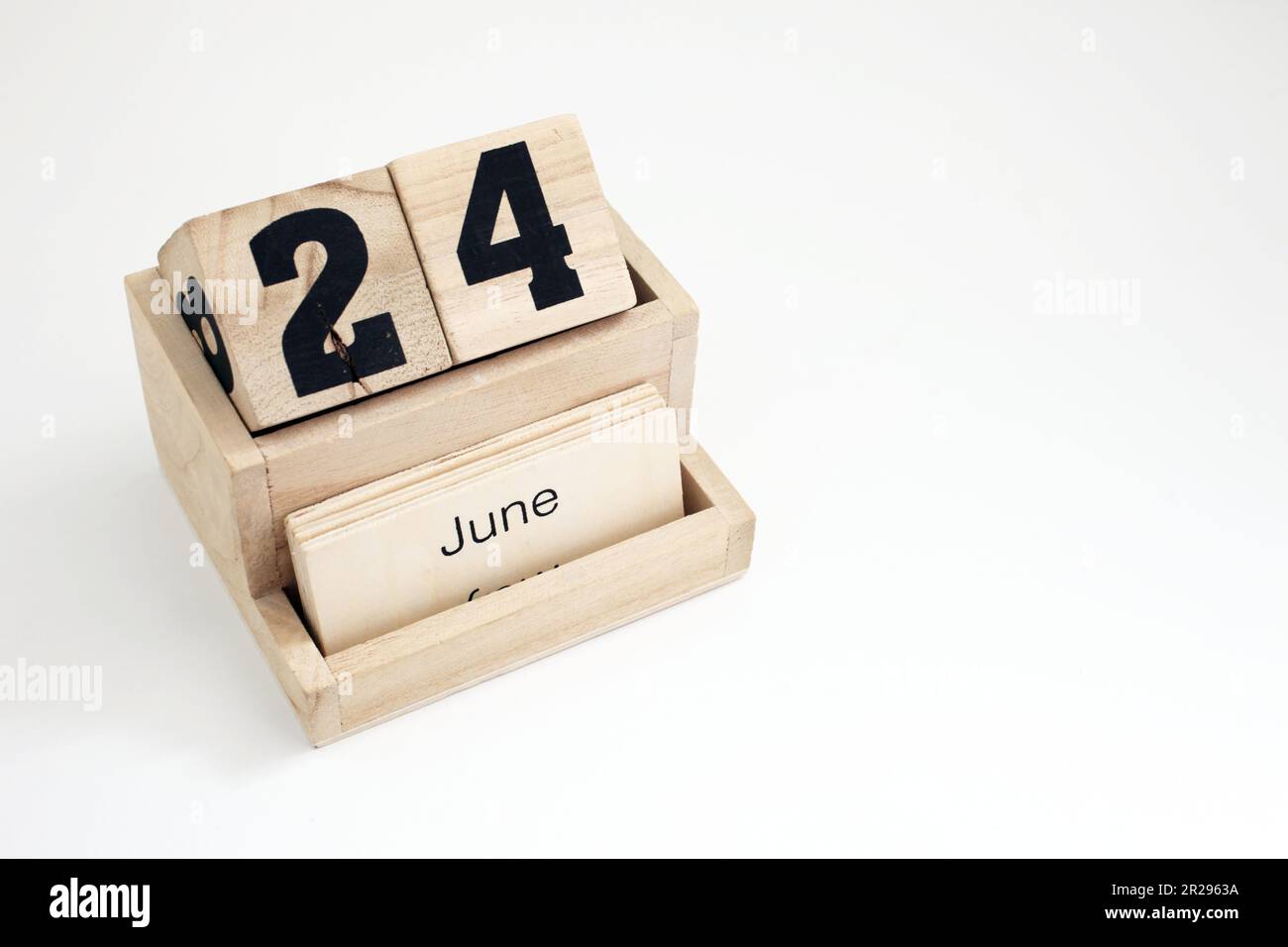 Wooden perpetual calendar showing the 24th of June Stock Photo - Alamy