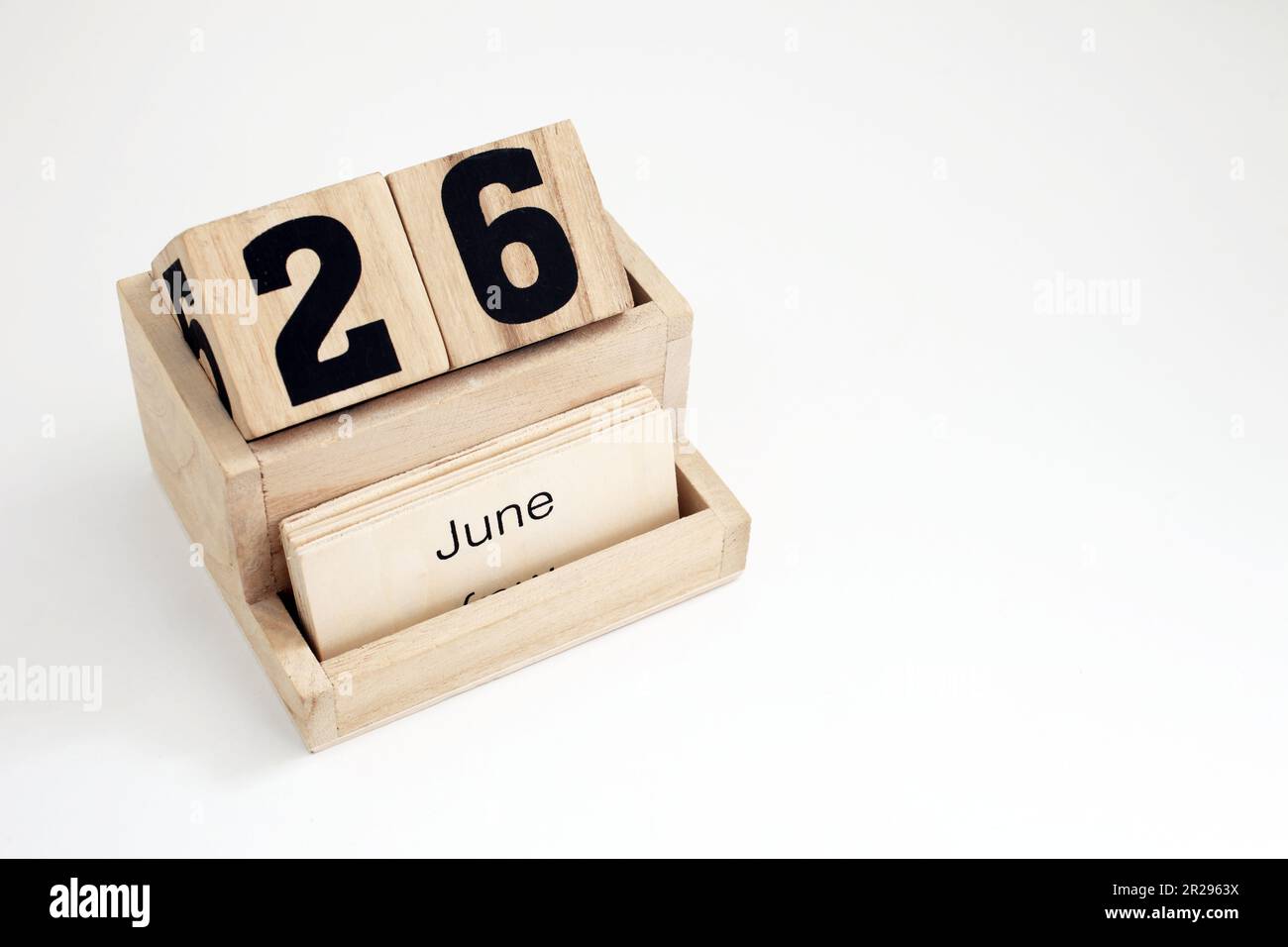 Wooden perpetual calendar showing the 26th of June Stock Photo - Alamy