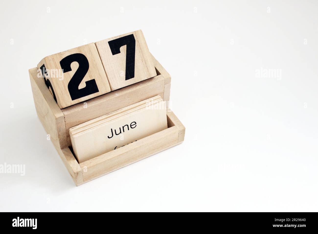Wooden perpetual calendar showing the 27th of June Stock Photo - Alamy