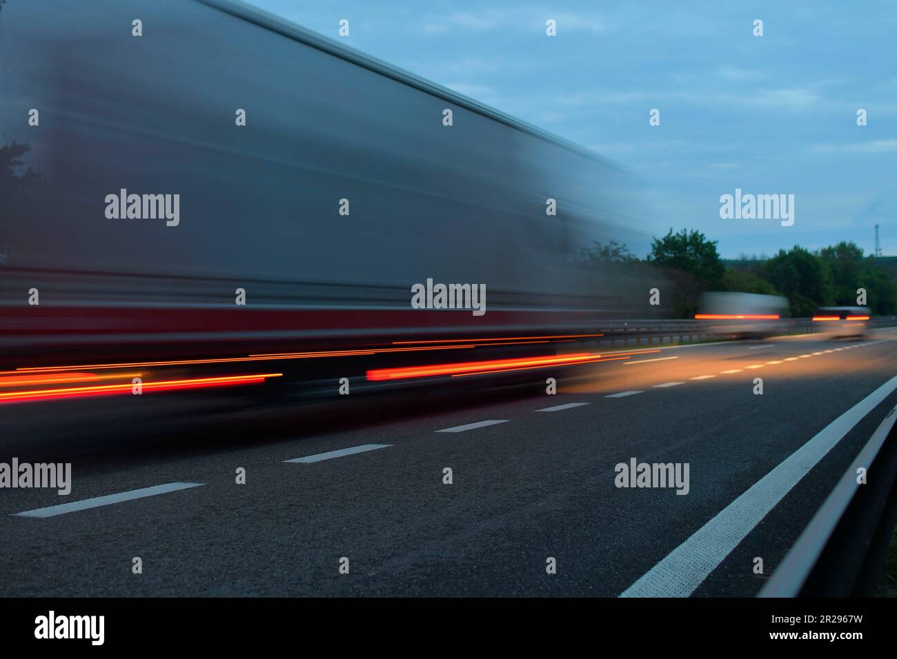 A truck traveling at high speed on the highway. Motion blur on the ...