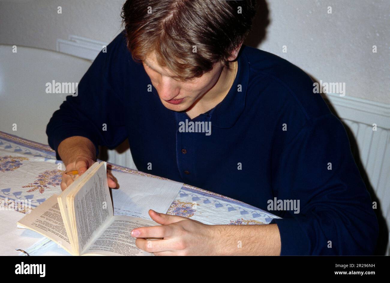 Teenage Boy Reading Studying For School Surrey England Stock Photo - Alamy