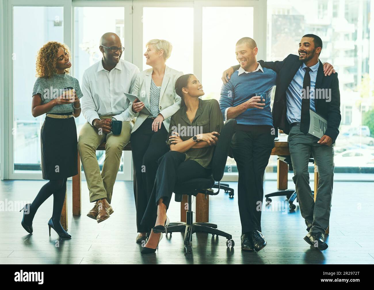 Teamwork, support and diversity with business people in office for team ...
