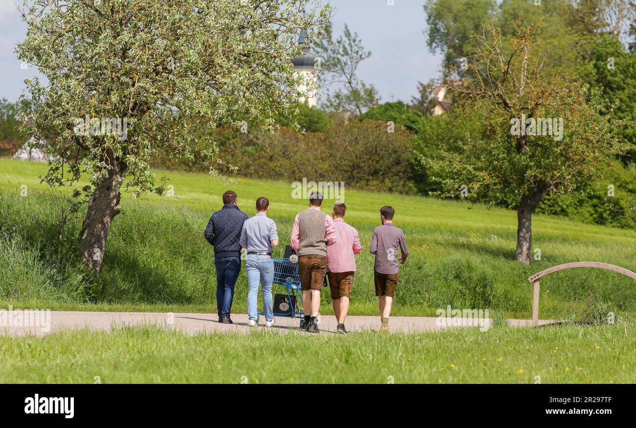Obermarchtal, Germany. 18th May, 2023. Men are on a hike with a cart on ...