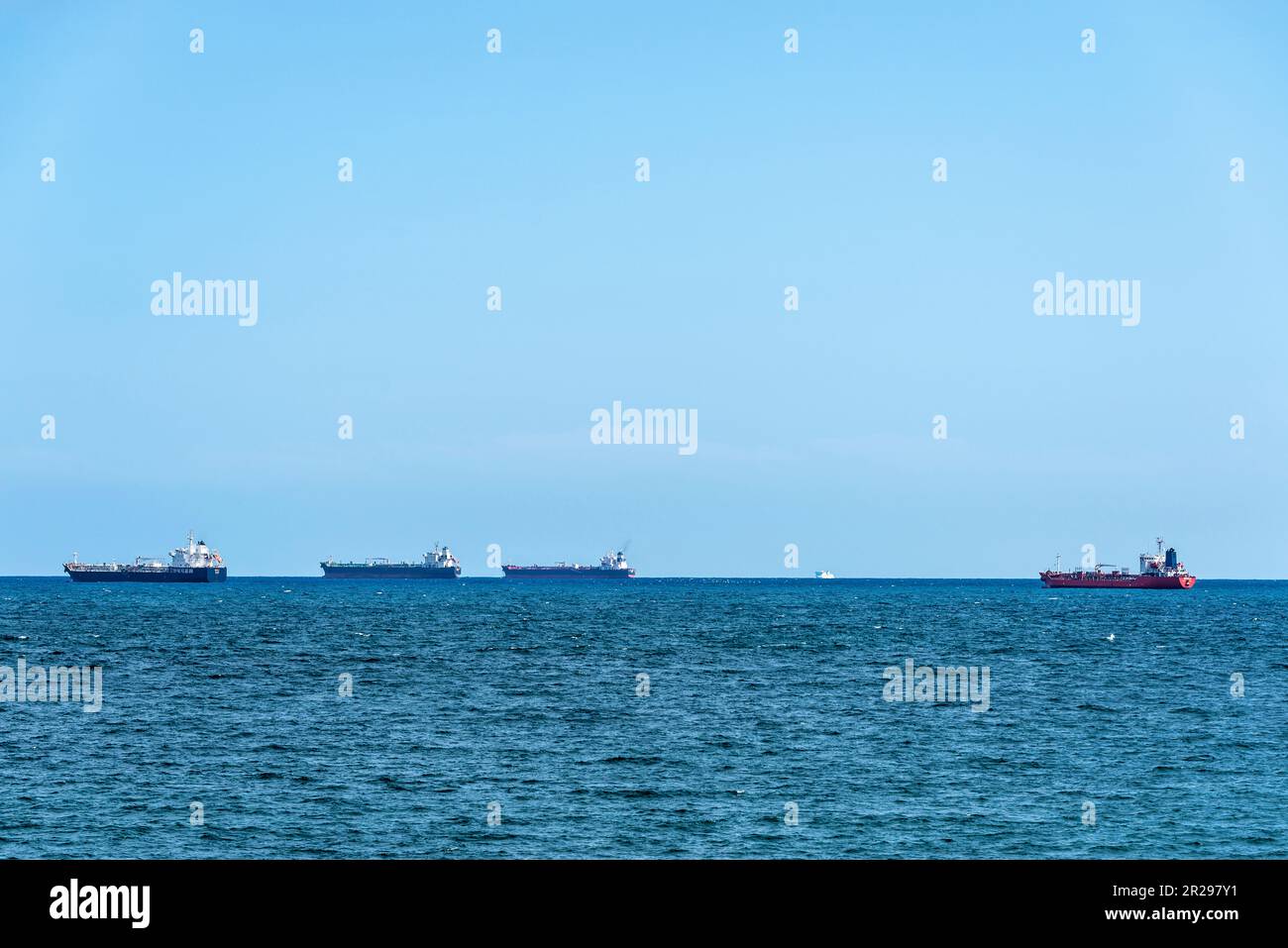 Four tanker ships sailing on the Mediterranean sea next of Barcelona ...