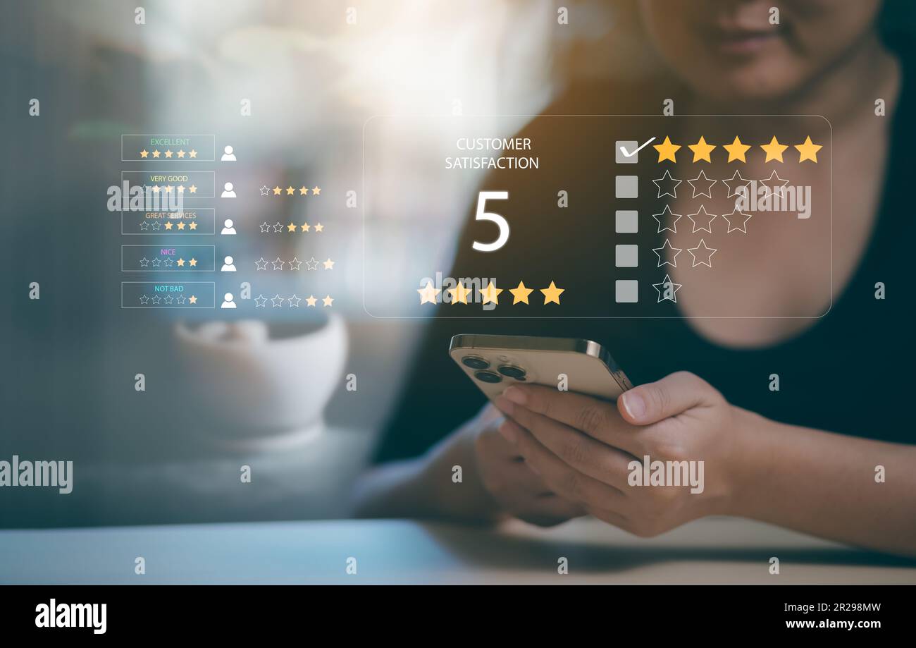 Woman touch smartphone with Customer review satisfaction feedback survey concept, User give ...