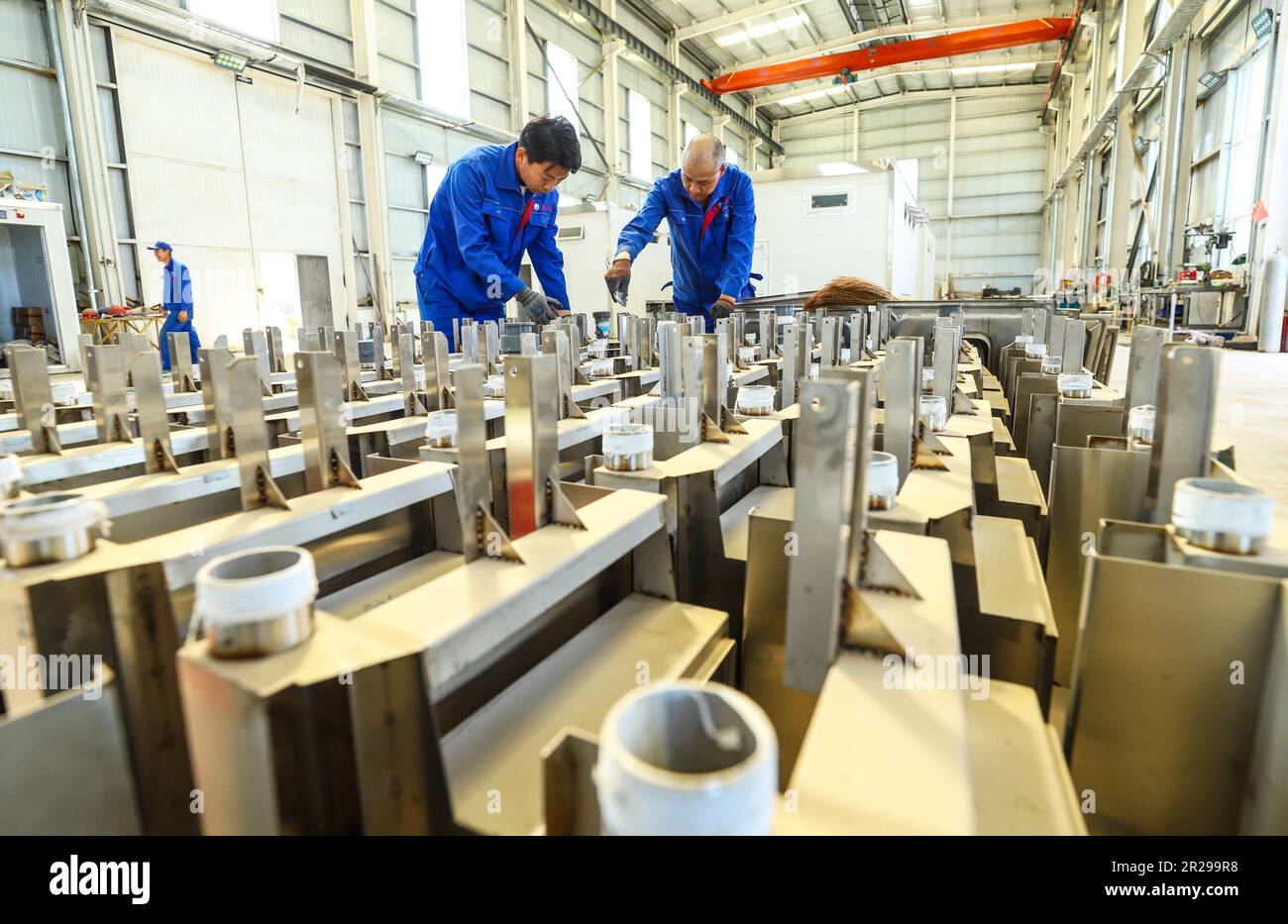 ZHANGYE, CHINA - MAY 18, 2023 - Workers assemble a biological engine ...