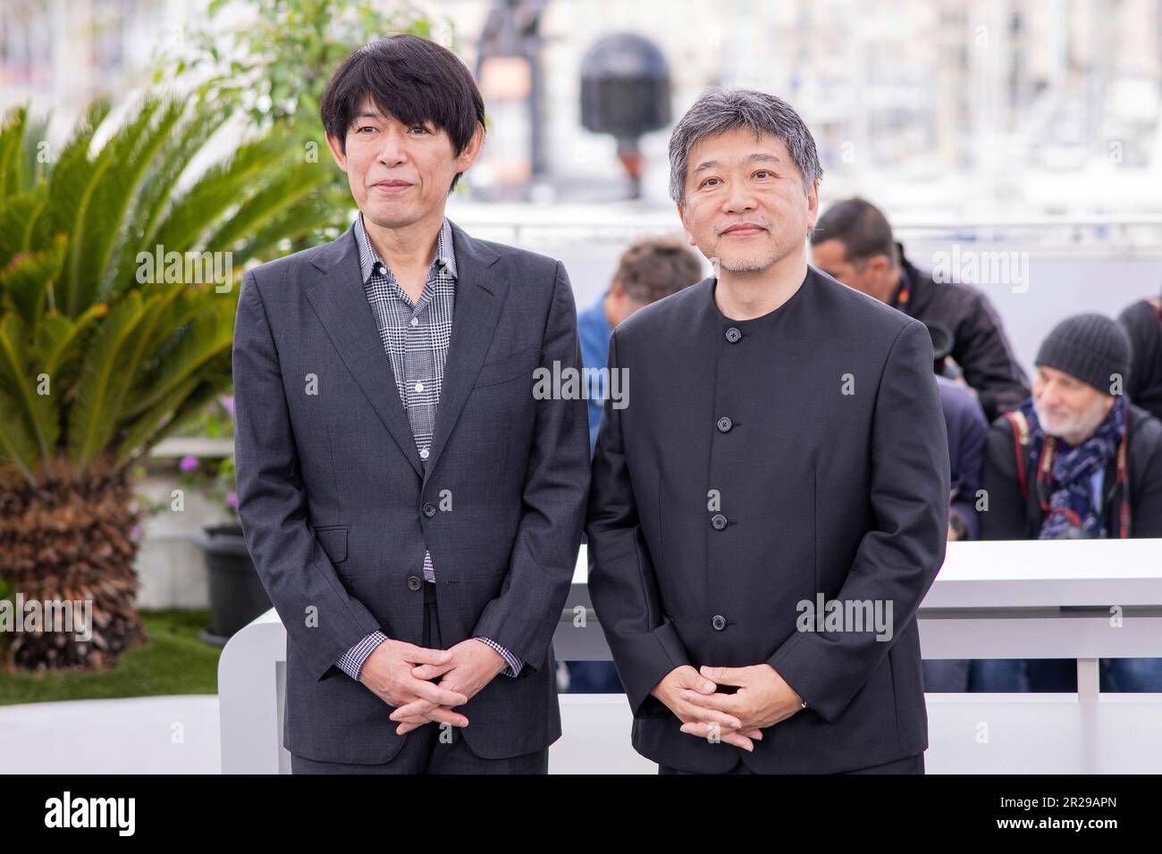 Yuji Sakamoto and Hirokazu Koreeda pose for photographers at the photo ...