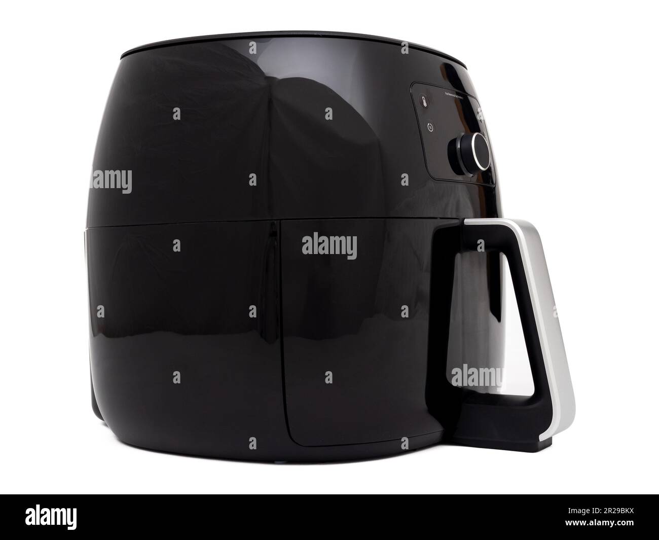 Black fryer on a white background. Deep fryer close-up Stock Photo - Alamy