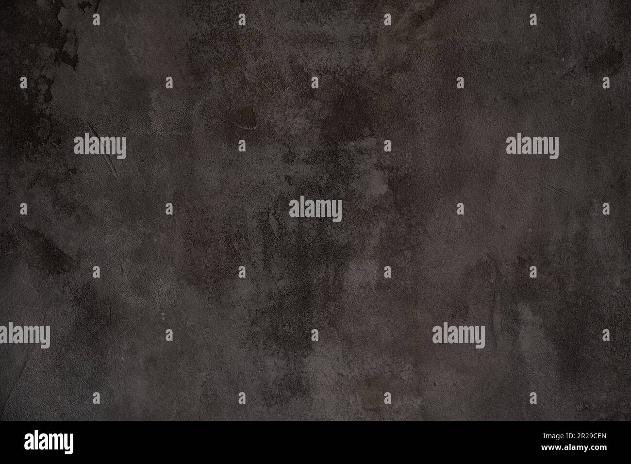 The stone surface is dark in color. The texture of old flagstone in the ...