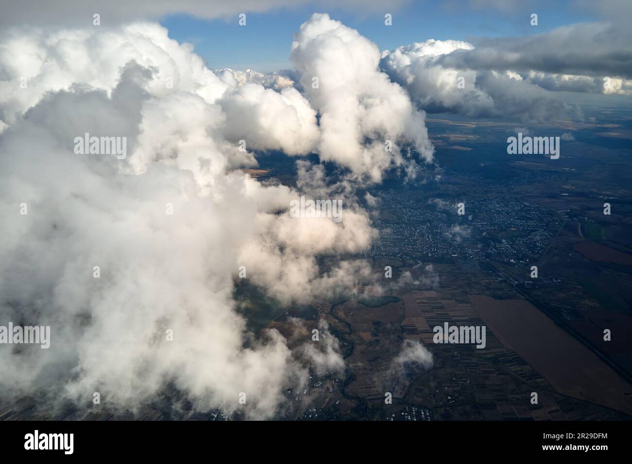 Aerial view from airplane window at high altitude of earth covered with ...
