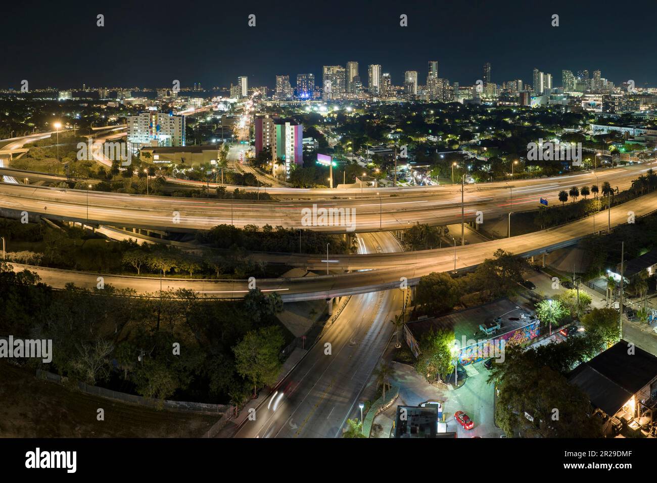 Aerial view of american freeway intersection at night with fast driving ...