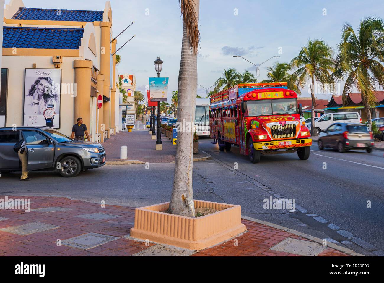 View of tourist bus on road in center of Oranjestad on island of Aruba ...