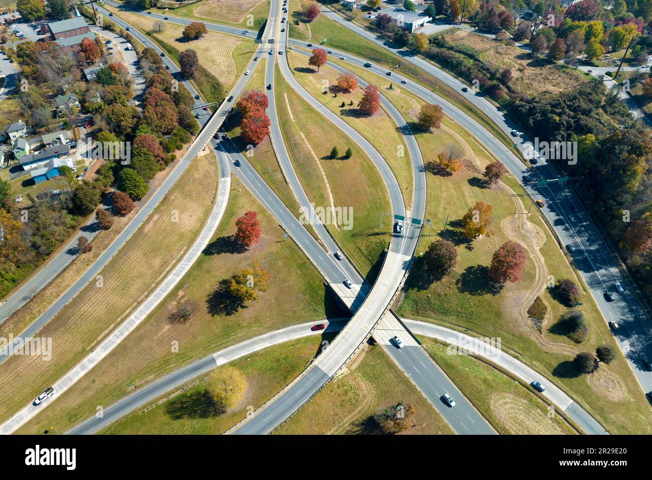 Aerial view of american freeway intersection with fast moving cars and ...