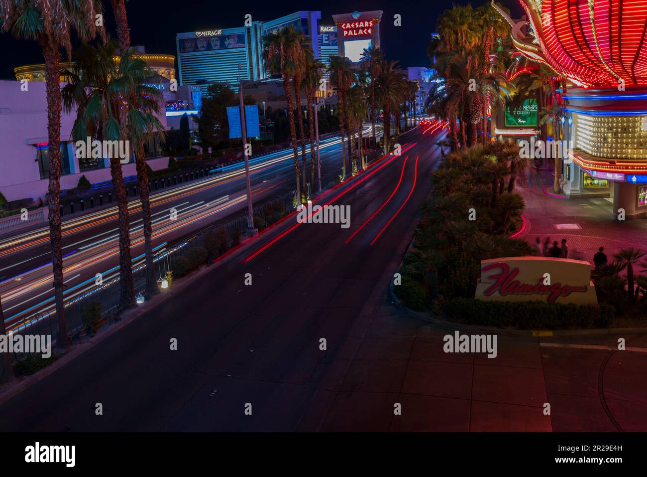 Beautiful out-of-focus strip road tracers. Night view of Las Vegas cityscape with gorgeous ...
