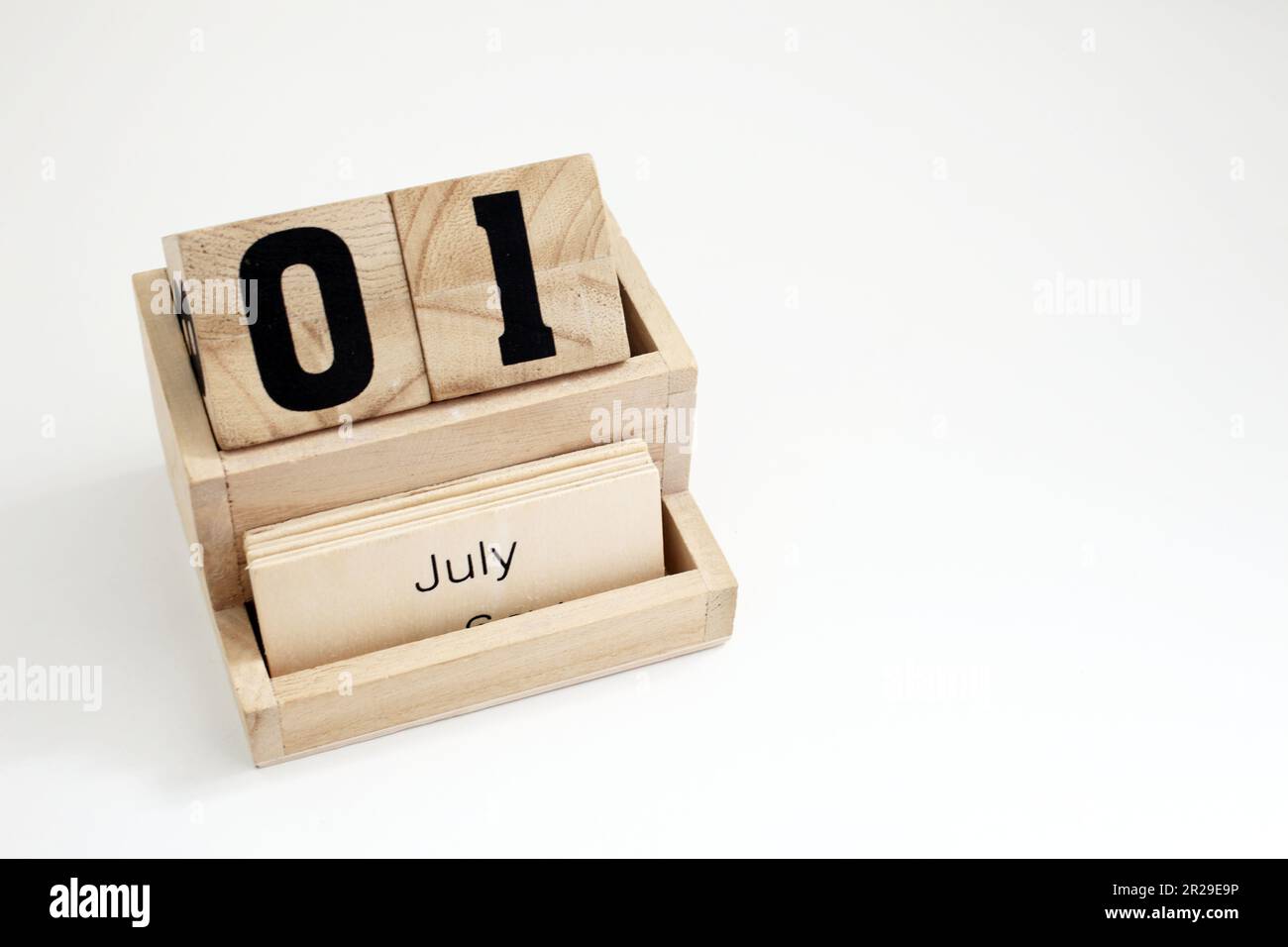 Wooden perpetual calendar showing the 1st of July Stock Photo - Alamy