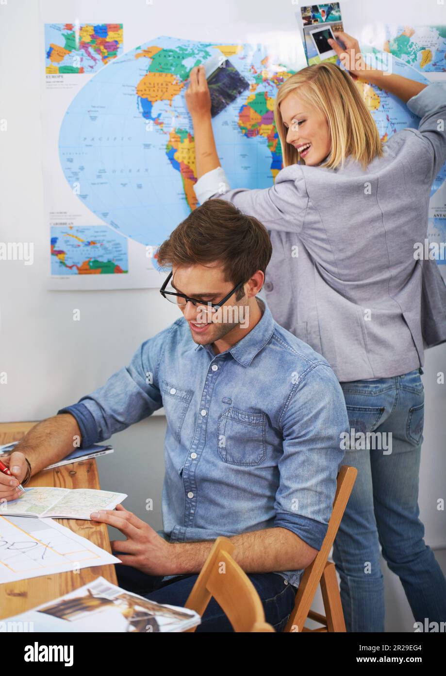 Travel agent, map and happy business people planning sightseeing ...