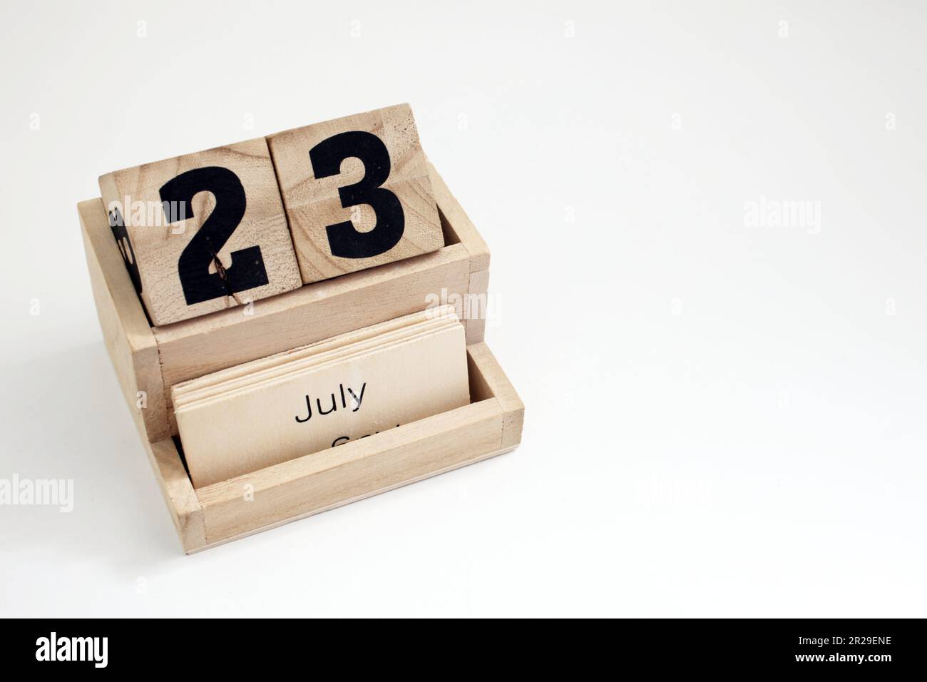 Wooden perpetual calendar showing the 23rd of July Stock Photo - Alamy