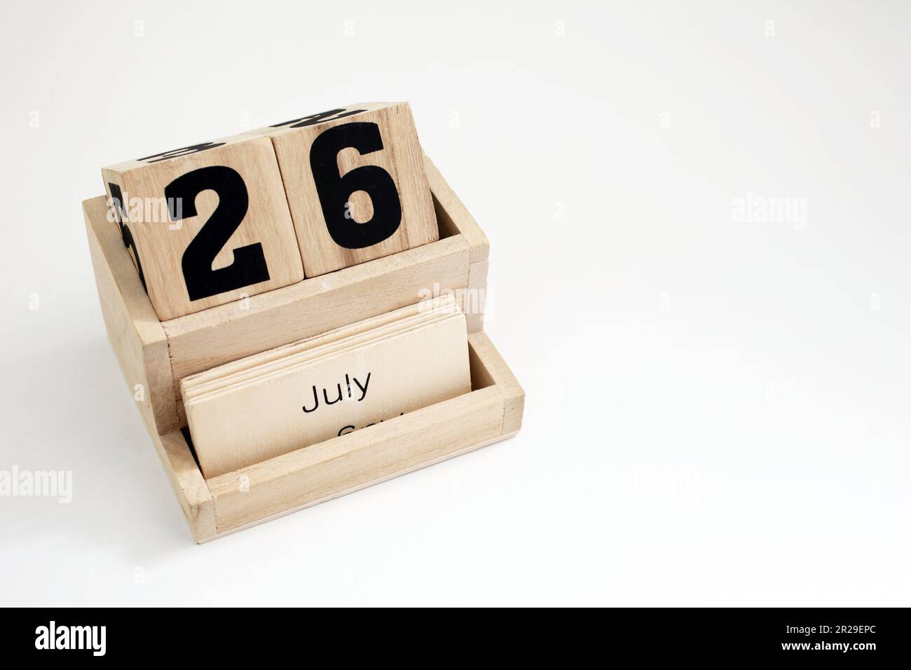 Wooden perpetual calendar showing the 26th of July Stock Photo - Alamy